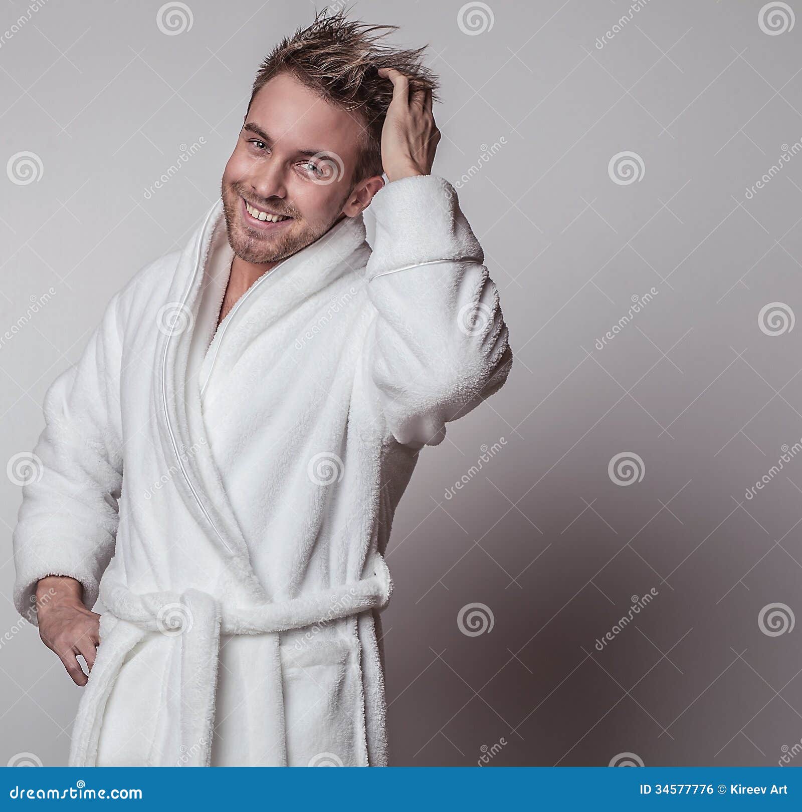 Handsome Smiling Young Man in Luxurious Bathrobe. Stock Photo - Image ...