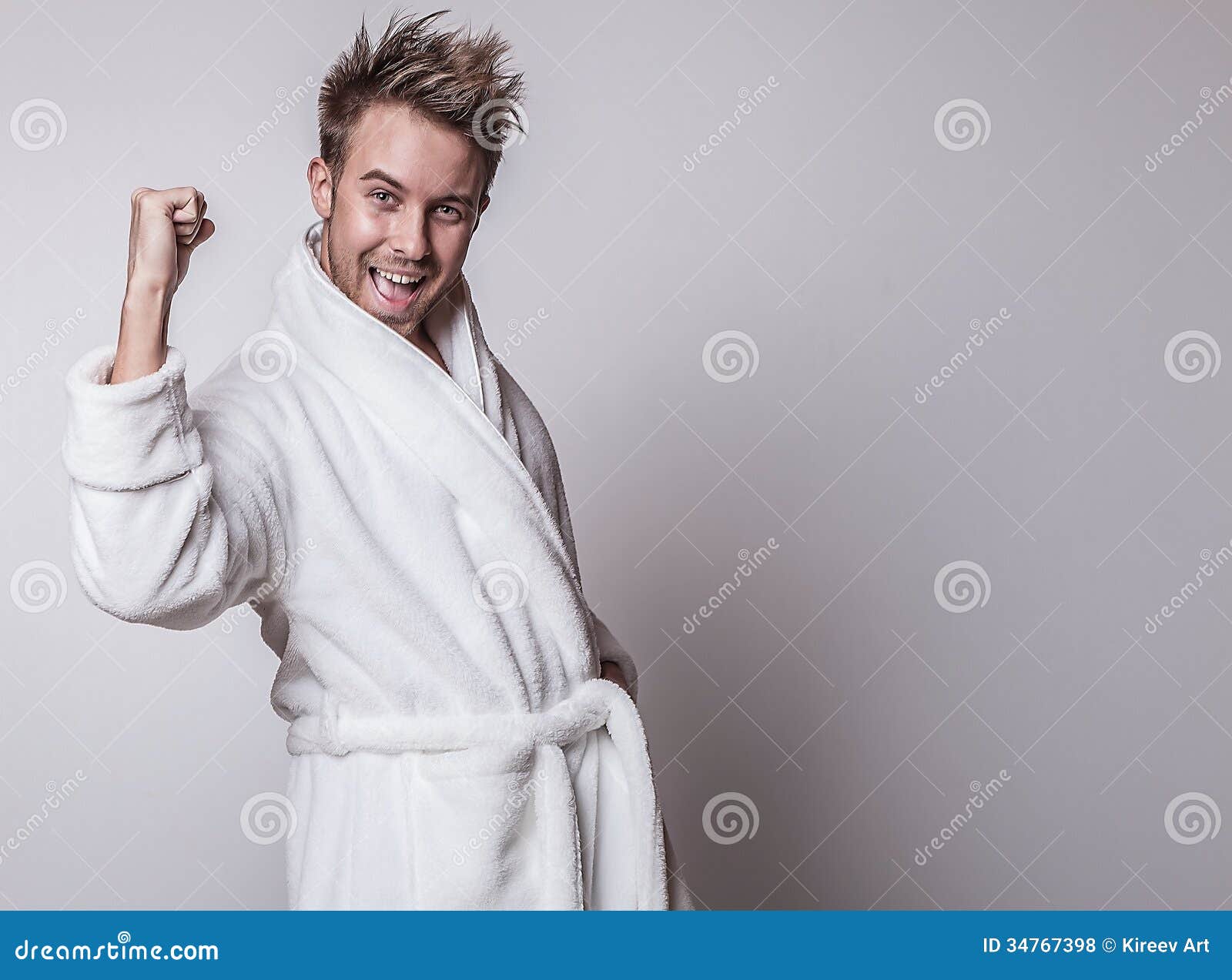 Handsome Smiling Young Man in Luxurious Bathrobe. Stock Photo - Image ...