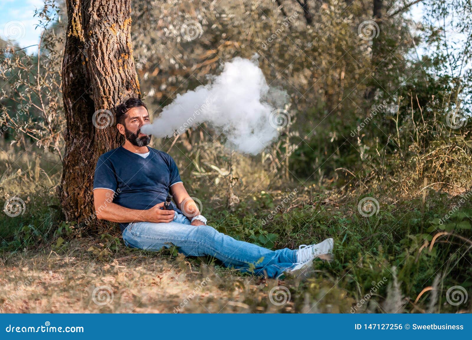 Handsome Smoker Enjoying an E-cigarette. Electronic Cigarette. Stock ...