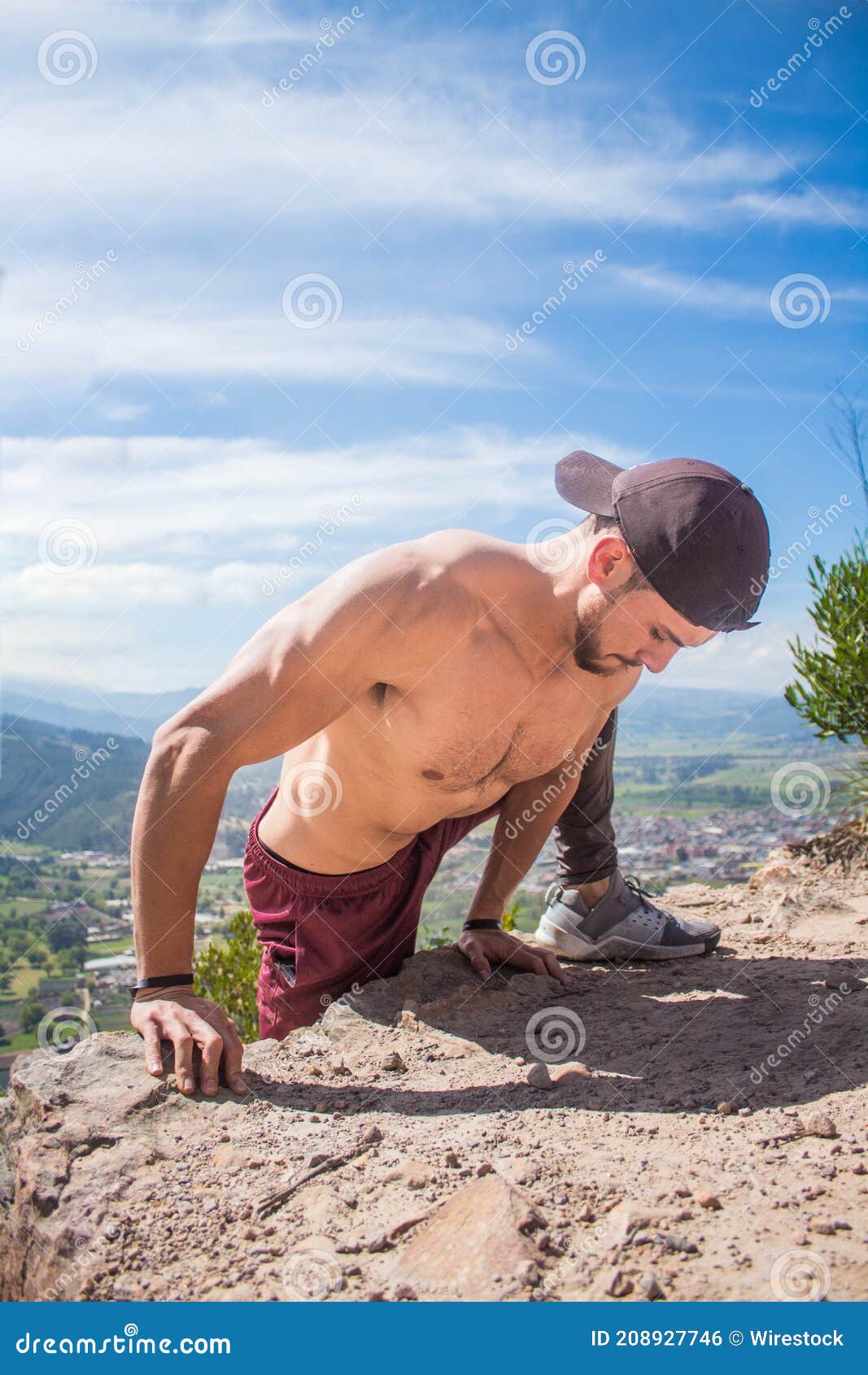 Handsome Sportsman Climbing a Rock Stock Photo - Image of body ...