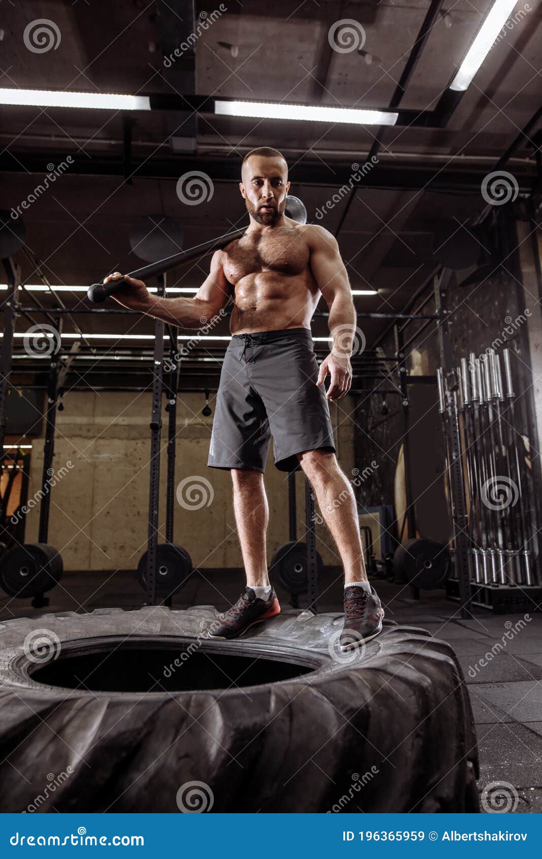 Handsome Sportsman with Hammer Behind His Back is Resting after ...
