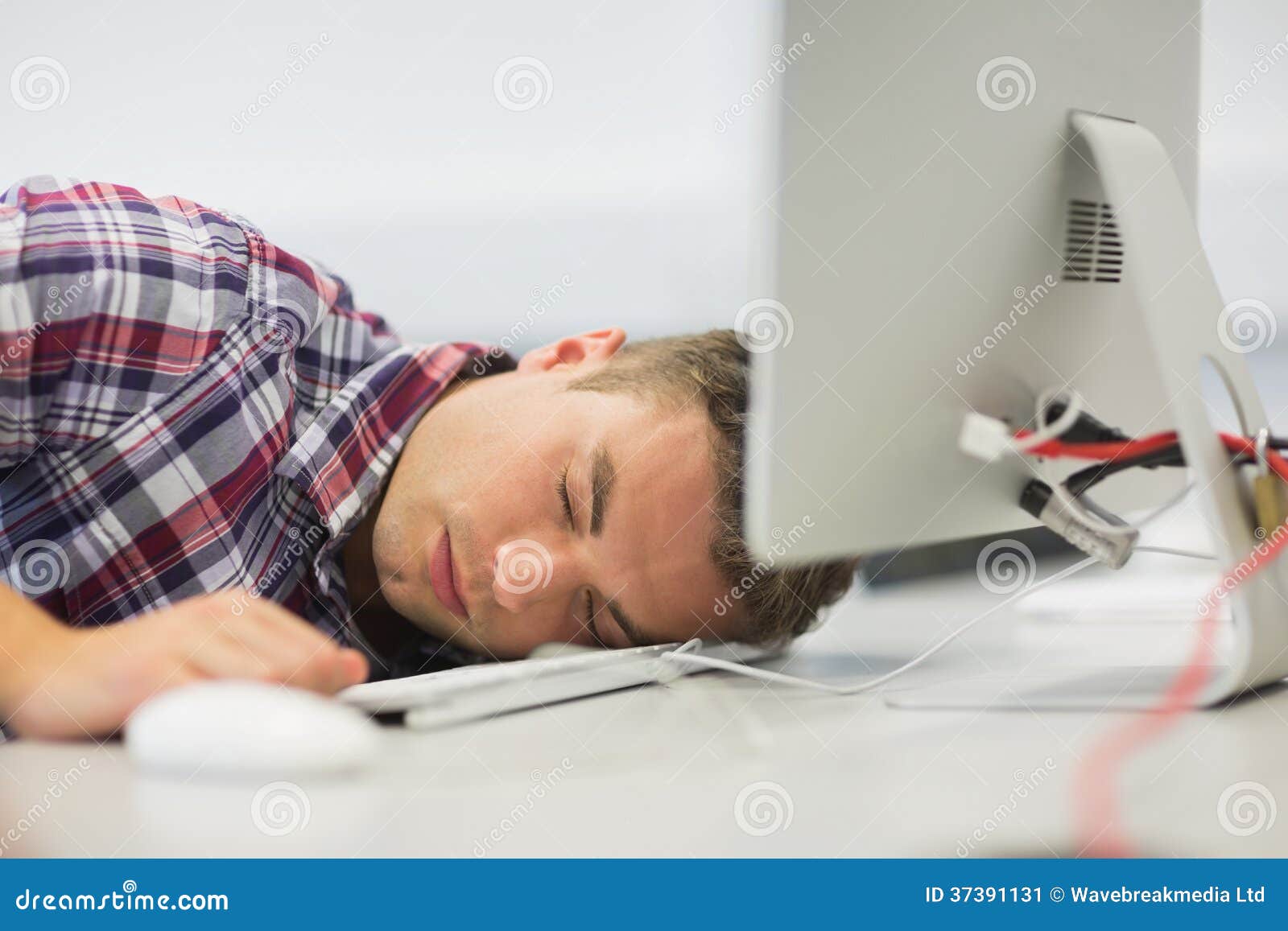 Dozing Student Sitting On Library Floor Leaning On Pile Of Books ...