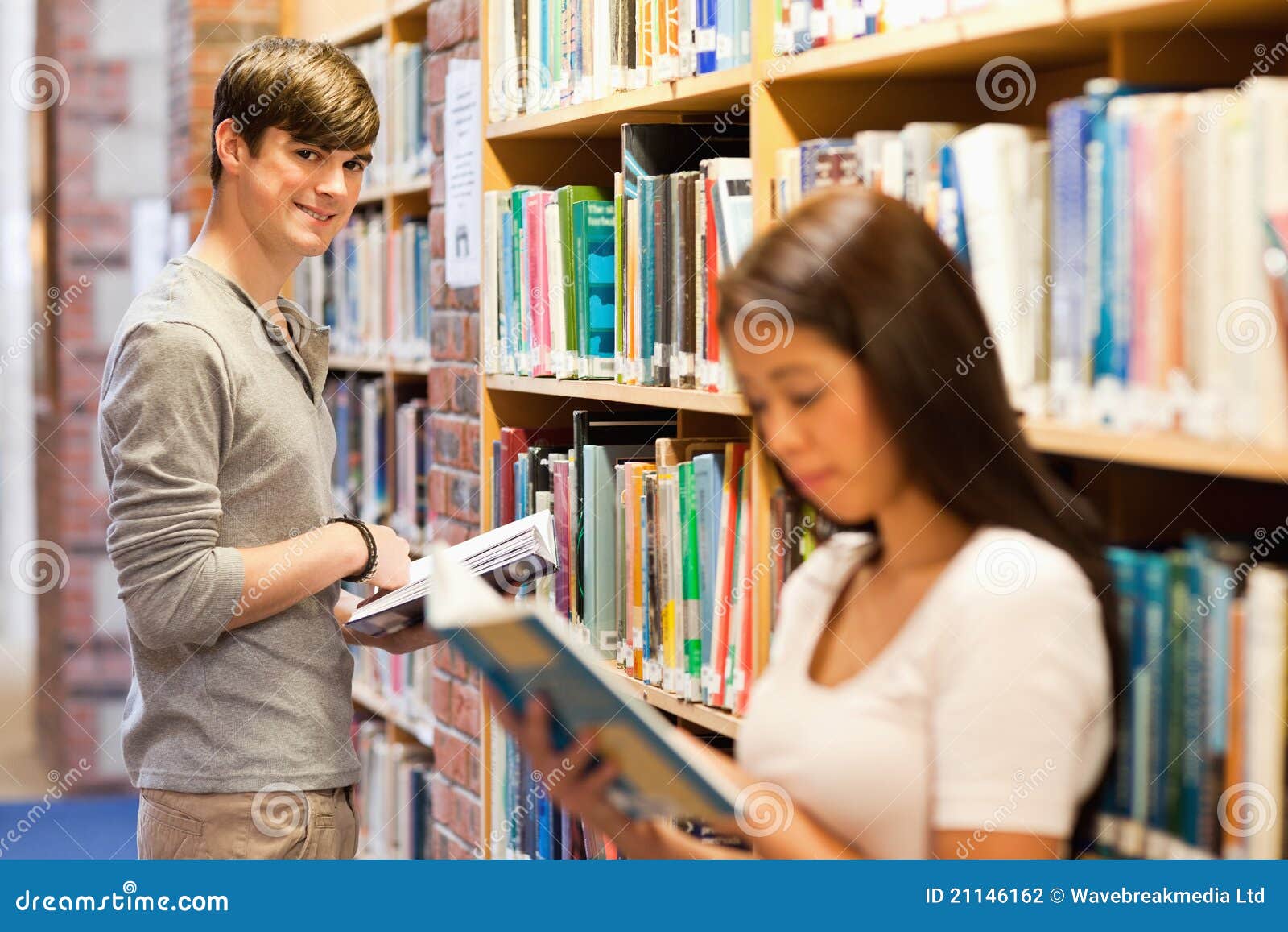 Handsome Student Holding a Book Stock Photo - Image of person ...