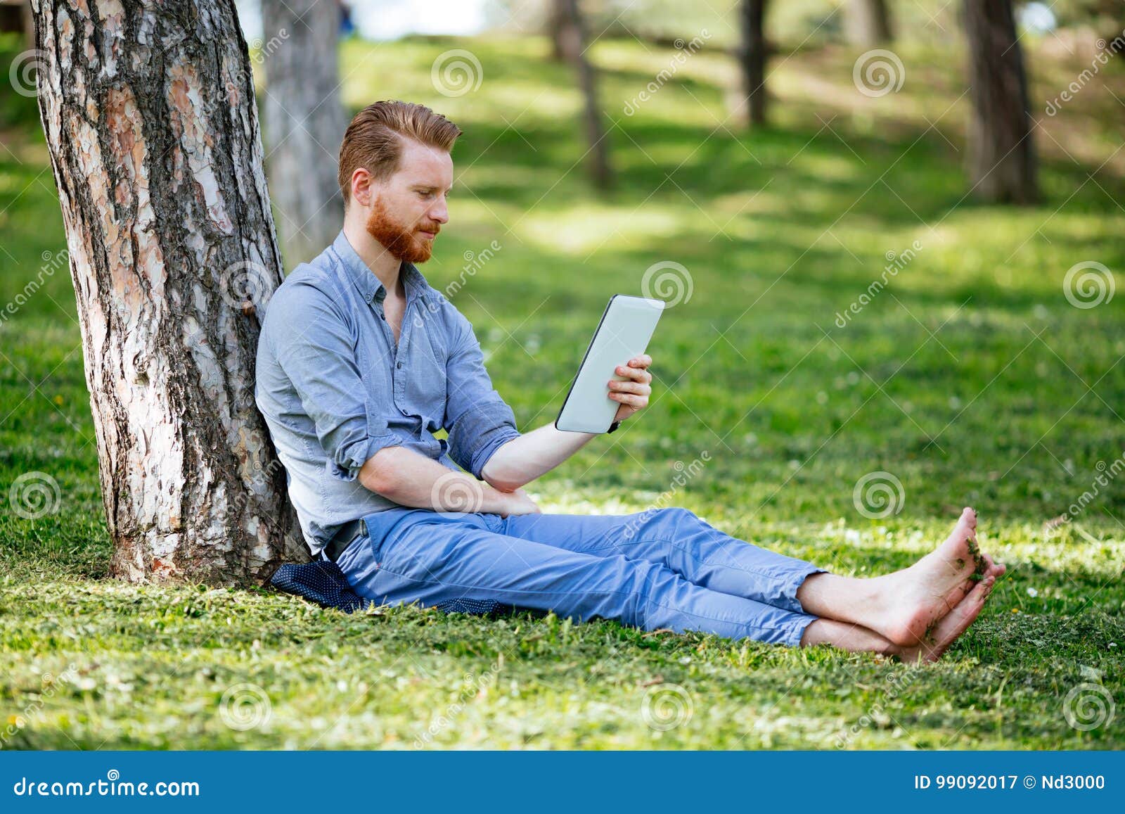 Handsome Student Reading in Nature Stock Image - Image of smiling ...