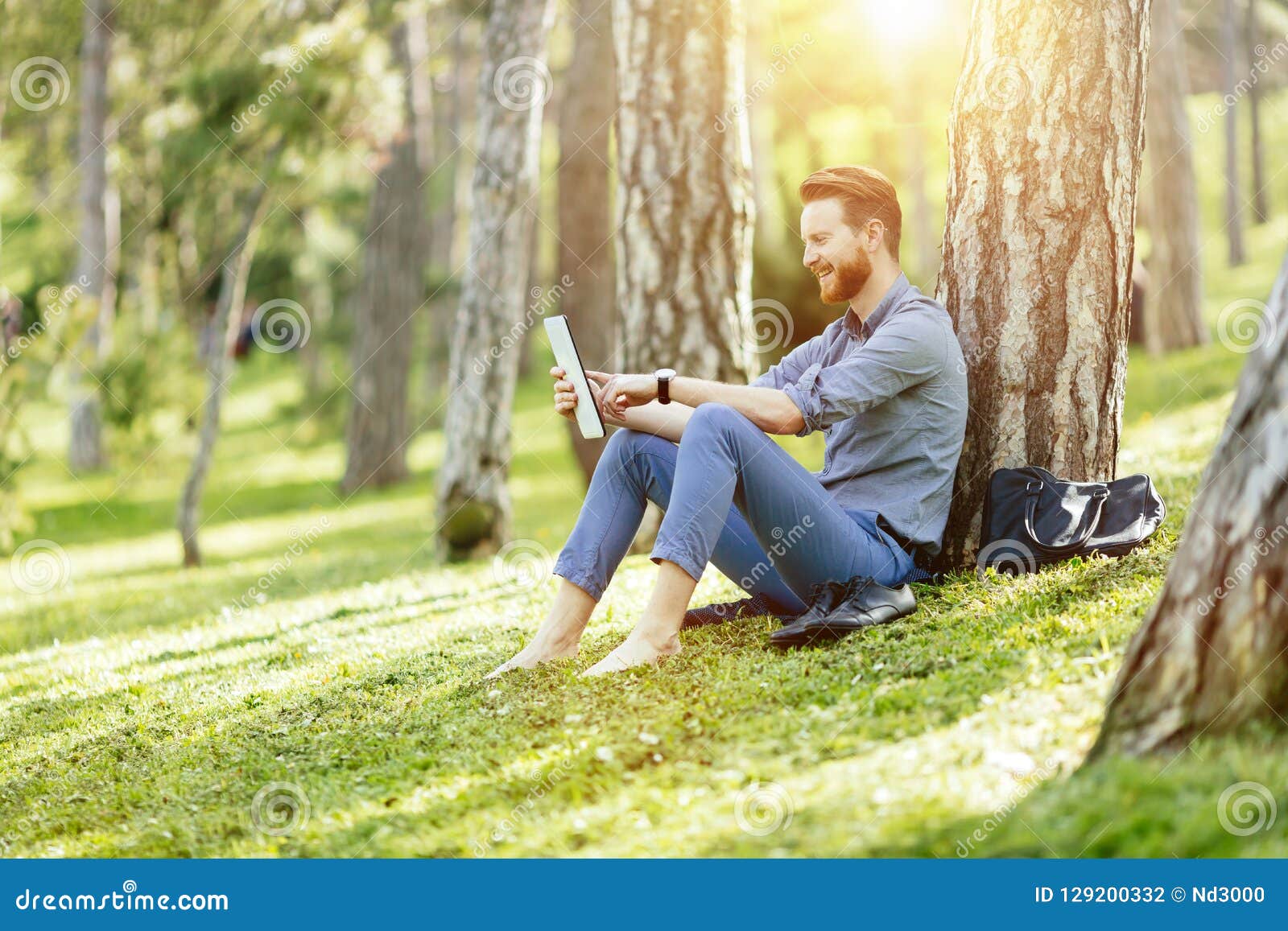 Handsome Student Reading in Nature Stock Photo - Image of cheerful ...
