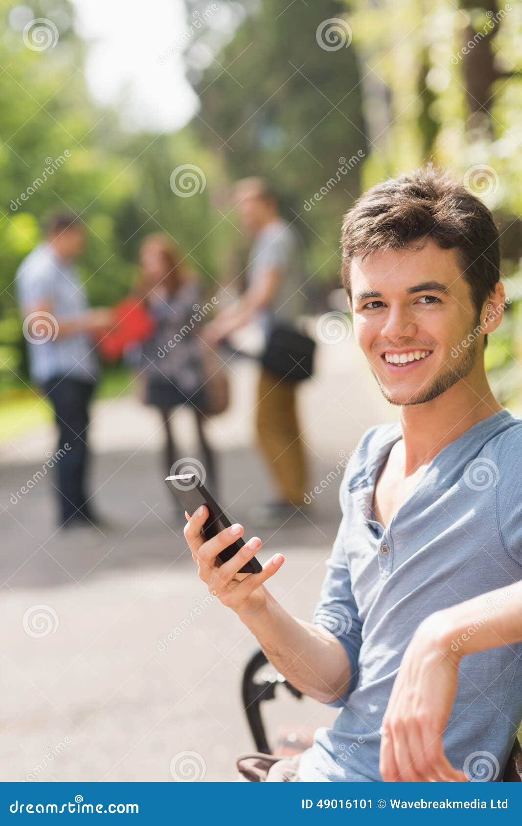 Handsome Student Sending a Text Outside Stock Image - Image of campus ...