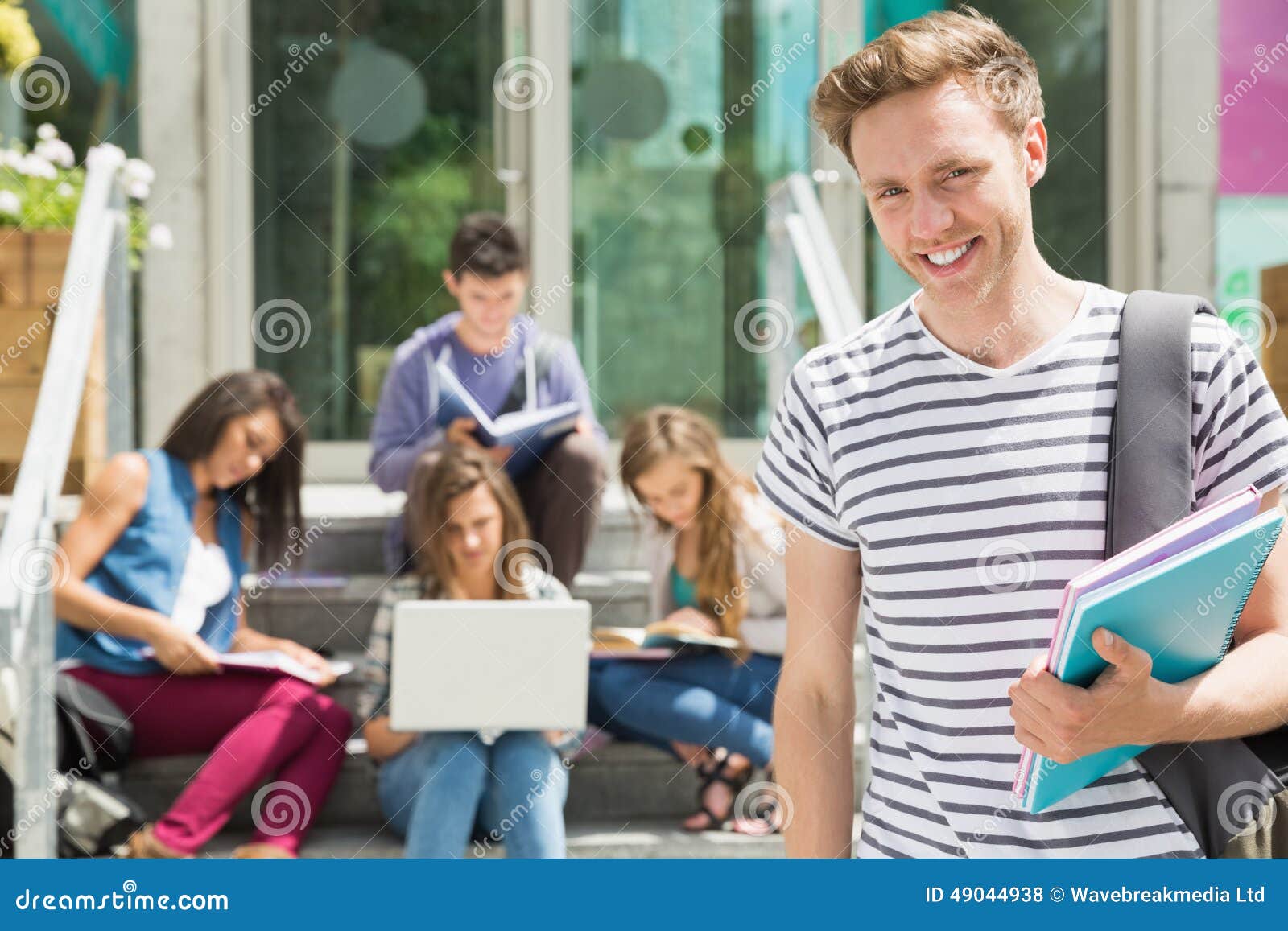 Handsome Student Smiling at Camera Outside Stock Photo - Image of ...