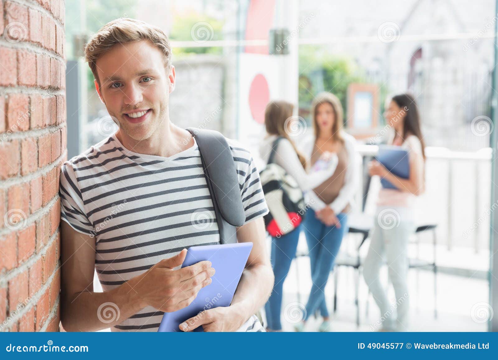 Handsome Student Smiling and Holding Tablet Stock Image - Image of ...