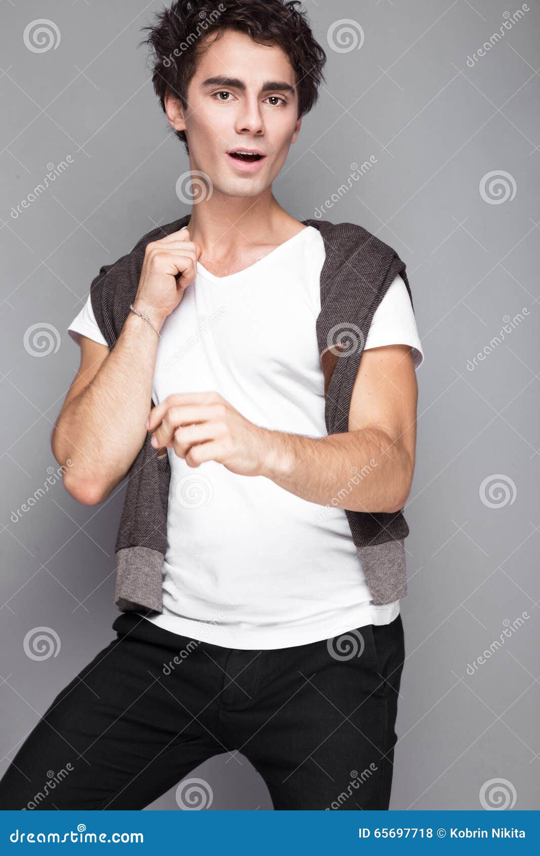 Handsome Style Cheerful Young Man In Smart Casual Wear Looking At