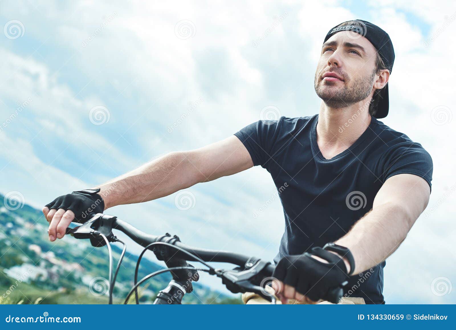 Handsome Stylish Guy Cycling at the Mountains. Bottom View Stock Image ...
