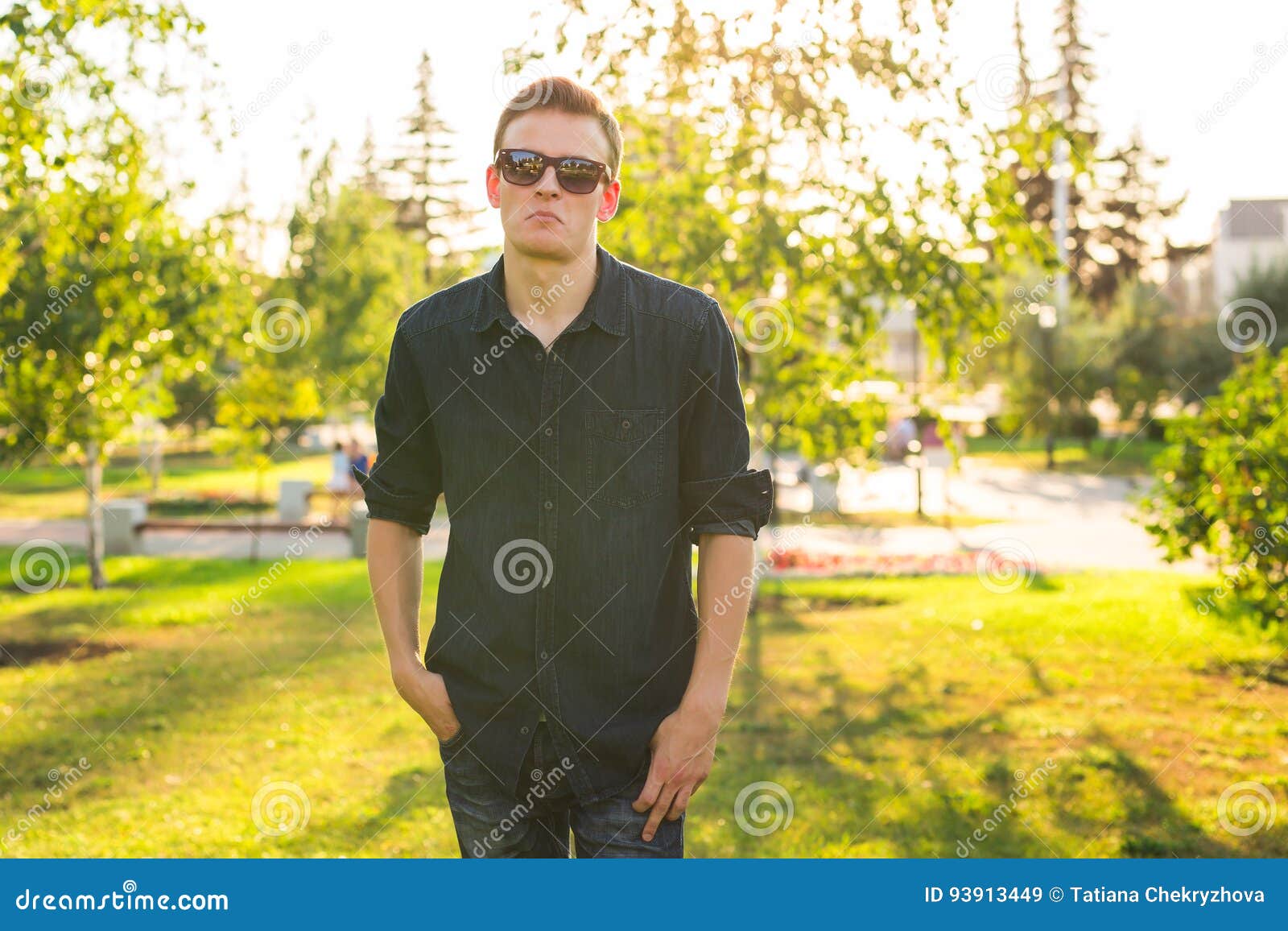 Handsome Stylish Hipster Man In Sunglasses Posing At Sunshine Nature