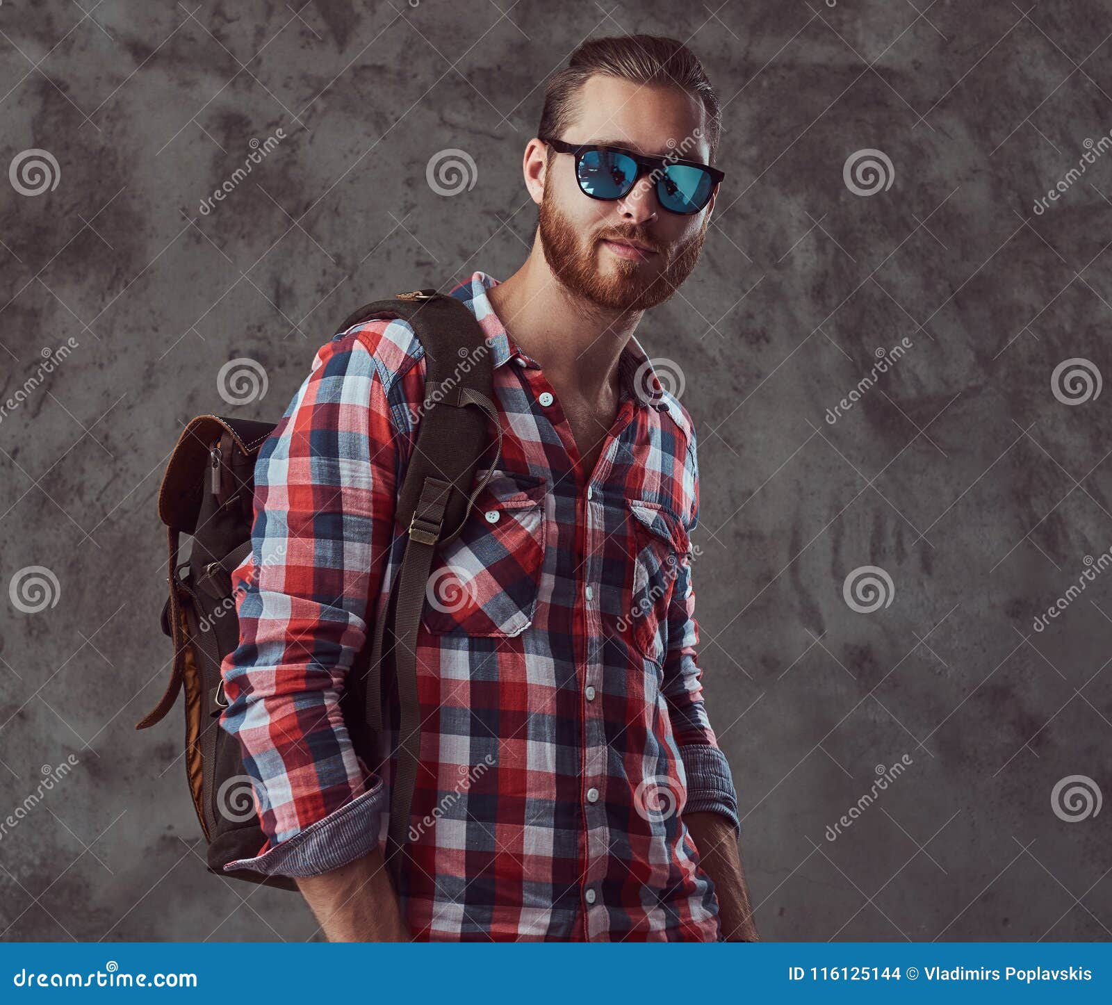Handsome Stylish Redhead Traveler In A Flannel Shirt And Sunglasses
