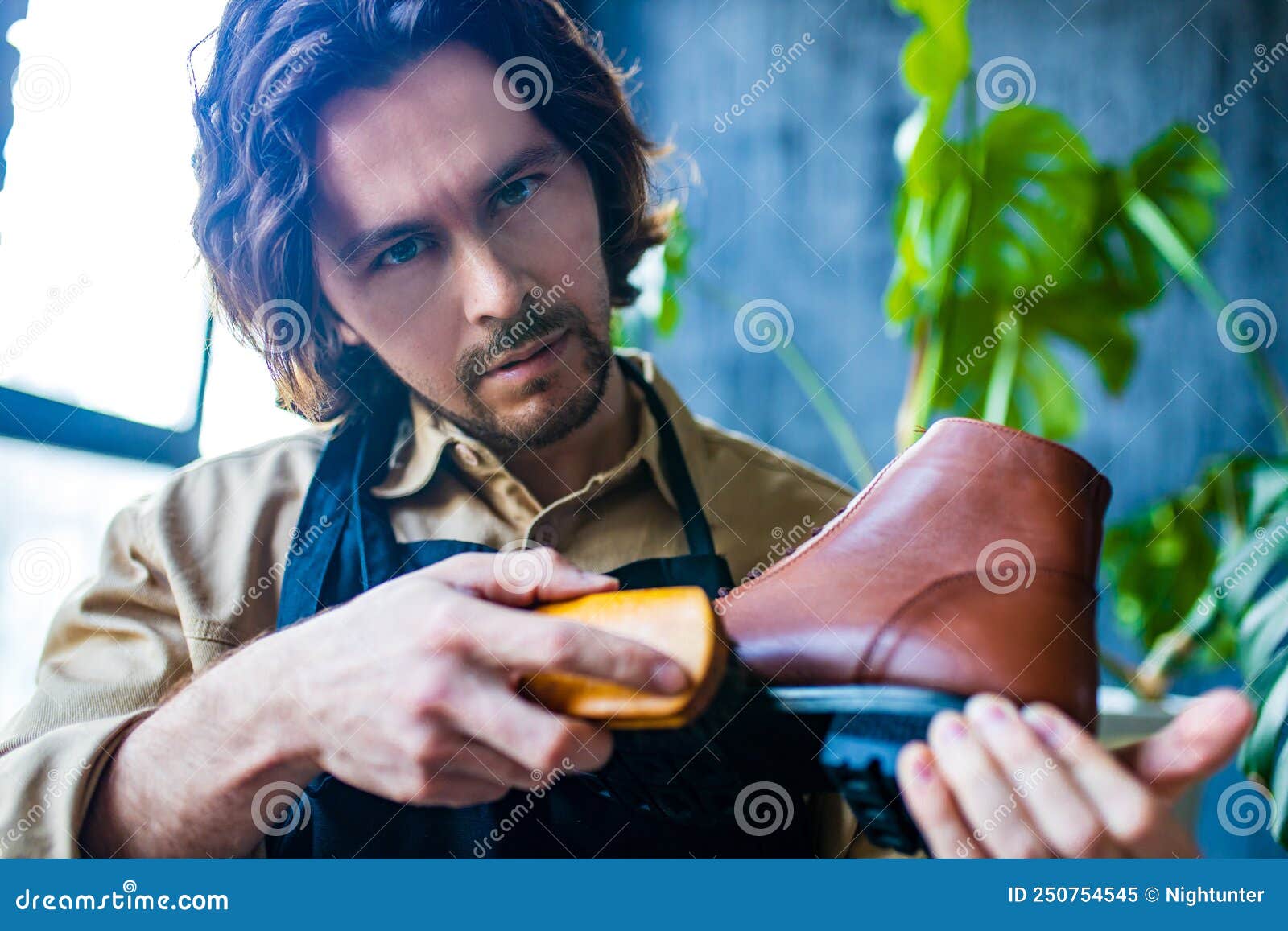 Handsome Tanner Master Tailor in a Work Apron Workking in Own Studio ...