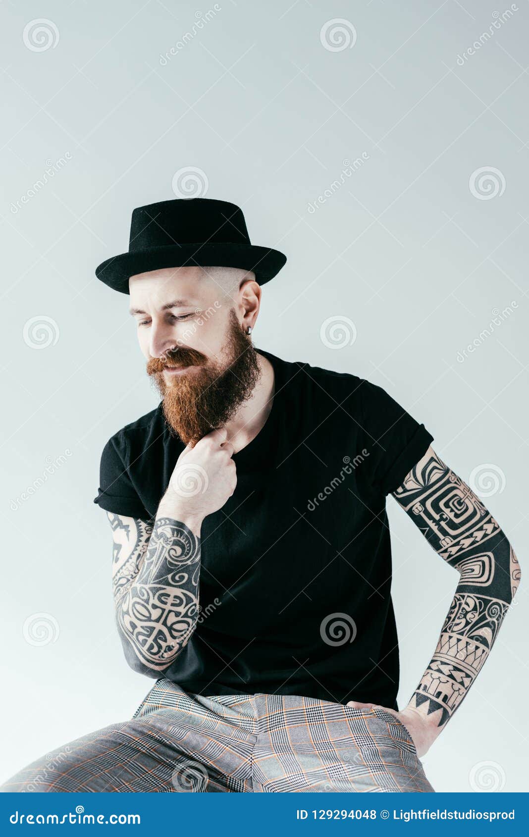 Handsome Tattooed Man Touching Beard Stock Photo - Image of bearded ...