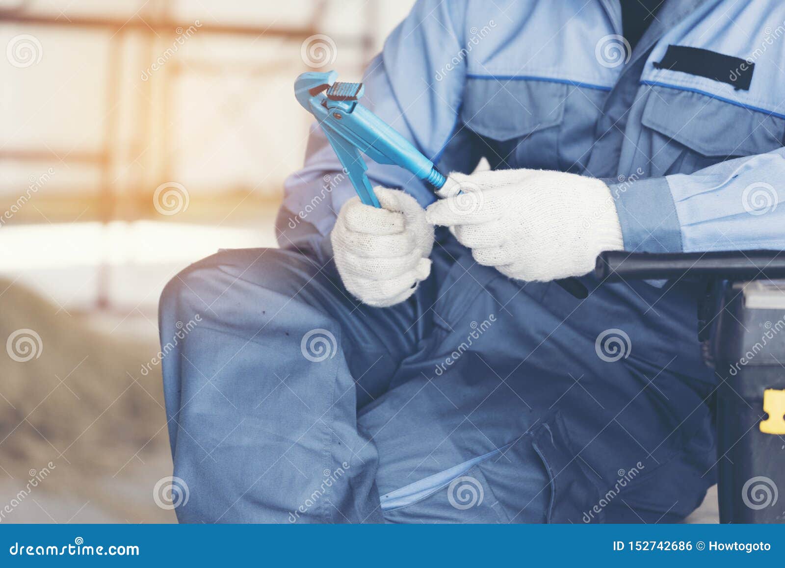 Handsome Technician Wear Technical Uniform Suit Holding Wrench in Hands ...