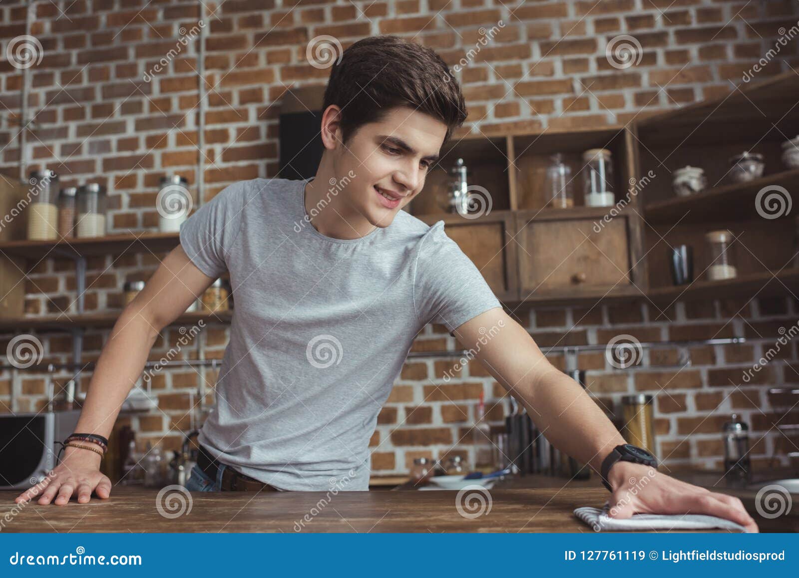 Handsome Teen Boy Cleaning Table with Rag Stock Image - Image of table, smile: 127761119