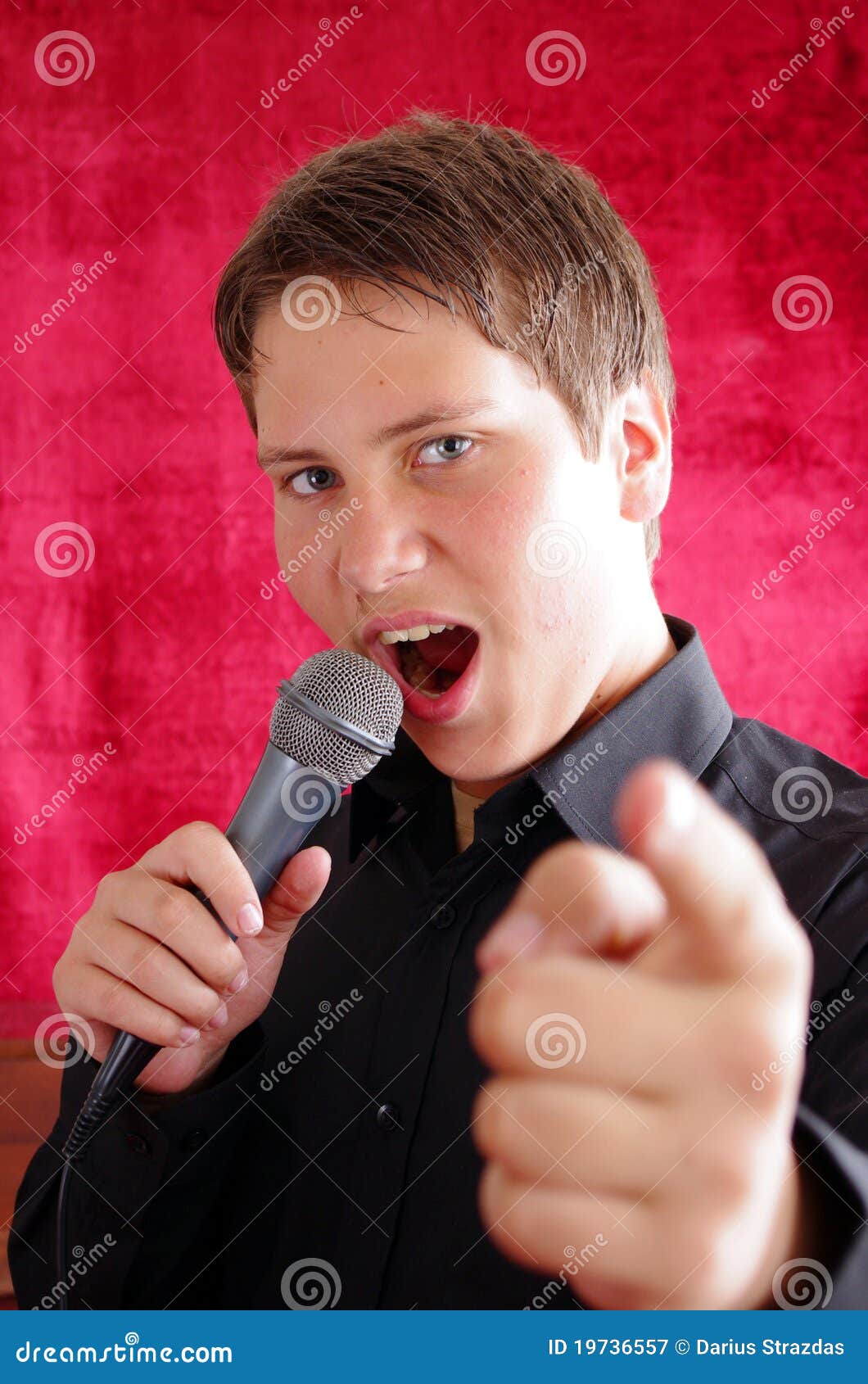 Handsome Teenager Male Singing with Microphone Stock Image - Image of ...