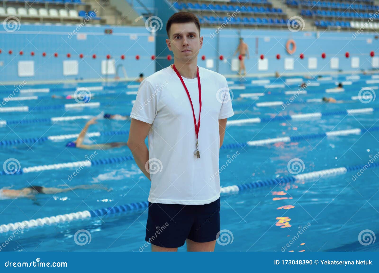 Handsome Trainer in White T-shirt Standing at the Swimming Pool Stock ...