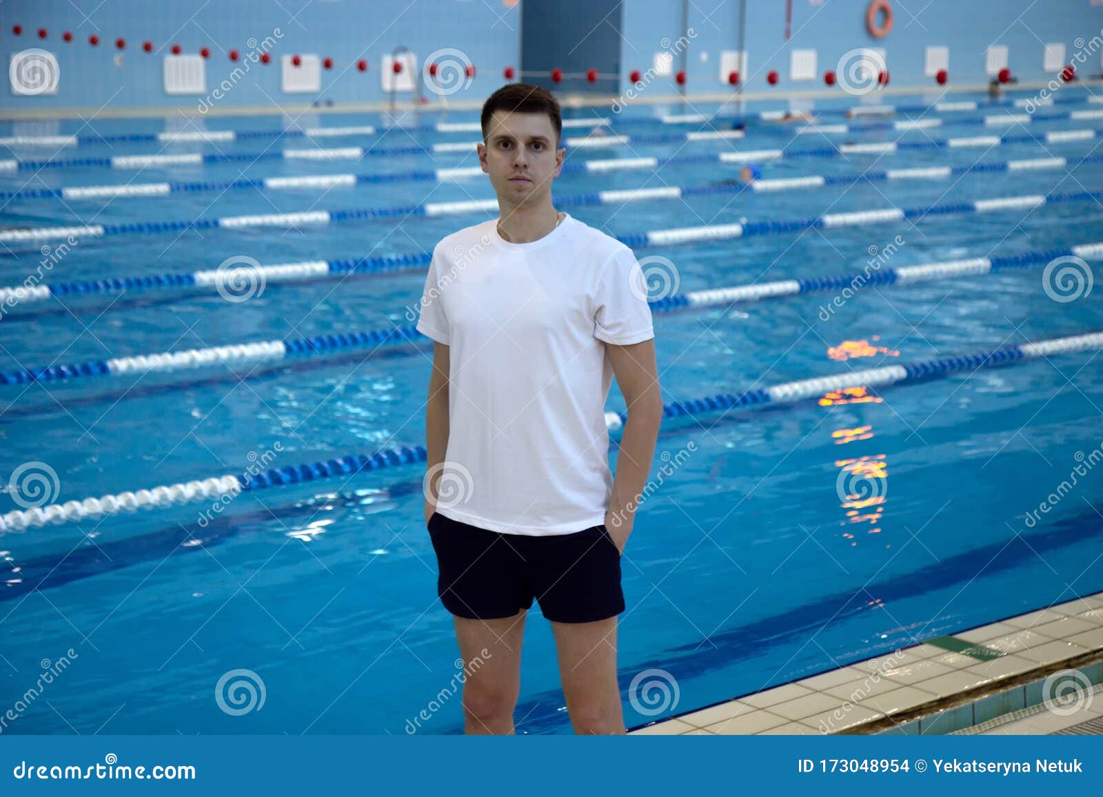 Handsome Trainer in White T-shirt Standing at the Swimming Pool Stock ...