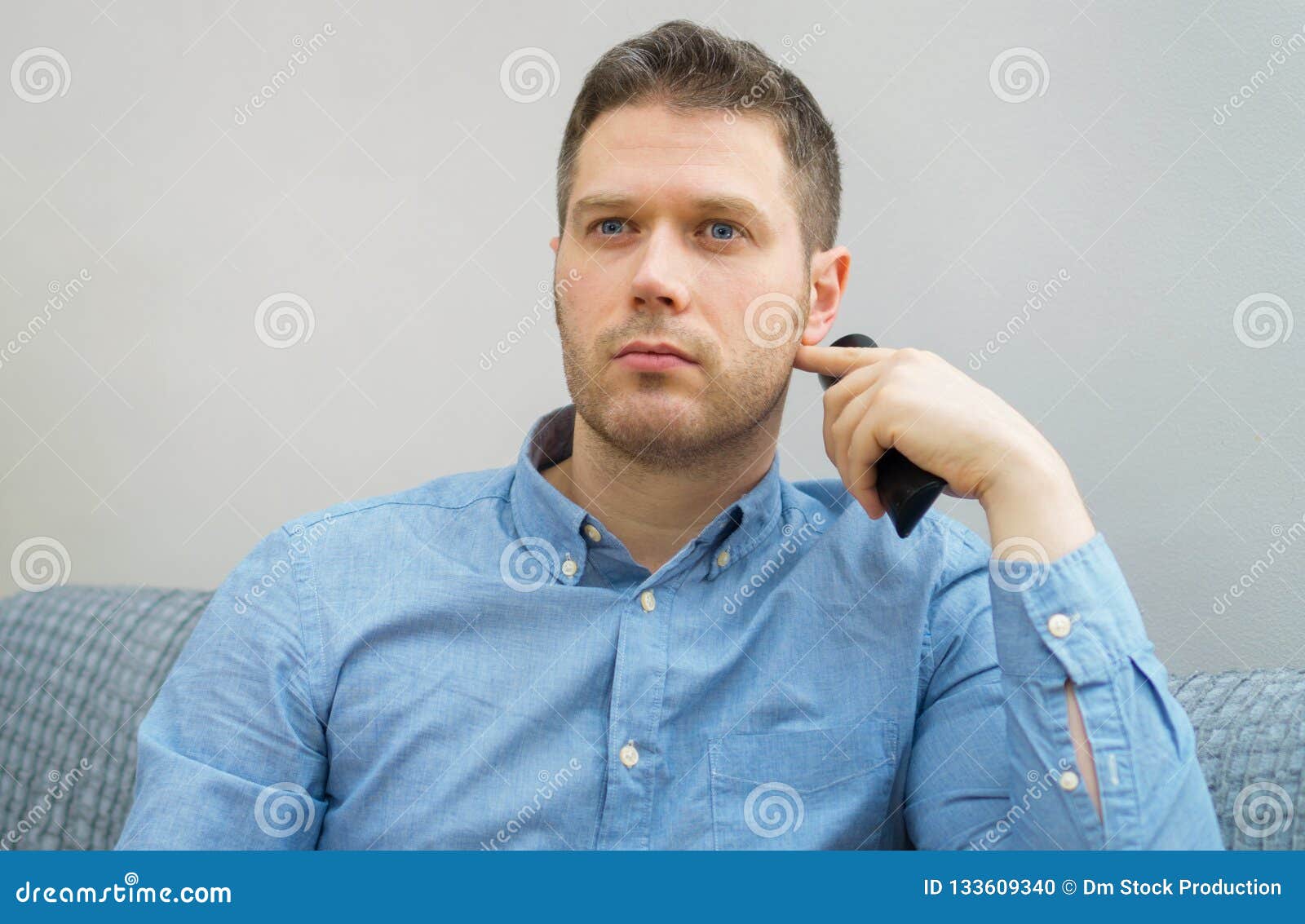Man watching TV at home stock photo. Image of video - 133609340