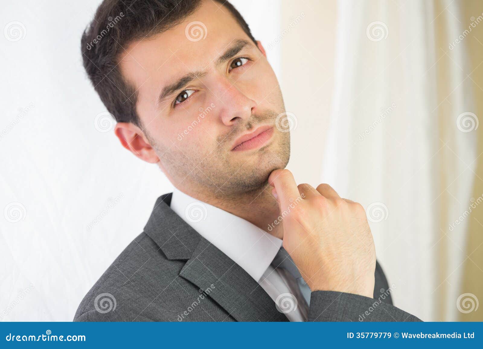 Handsome Unsmiling Businessman Posing at Camera Stock Image - Image of ...