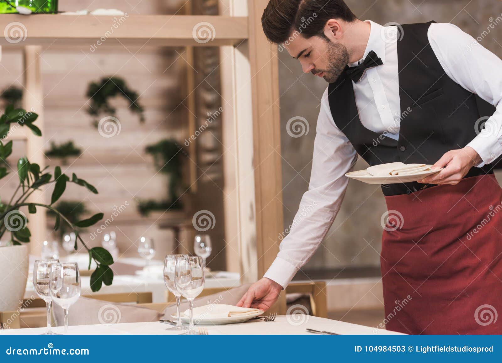 Waiter Serving Plates on Table Stock Image - Image of comfortable ...