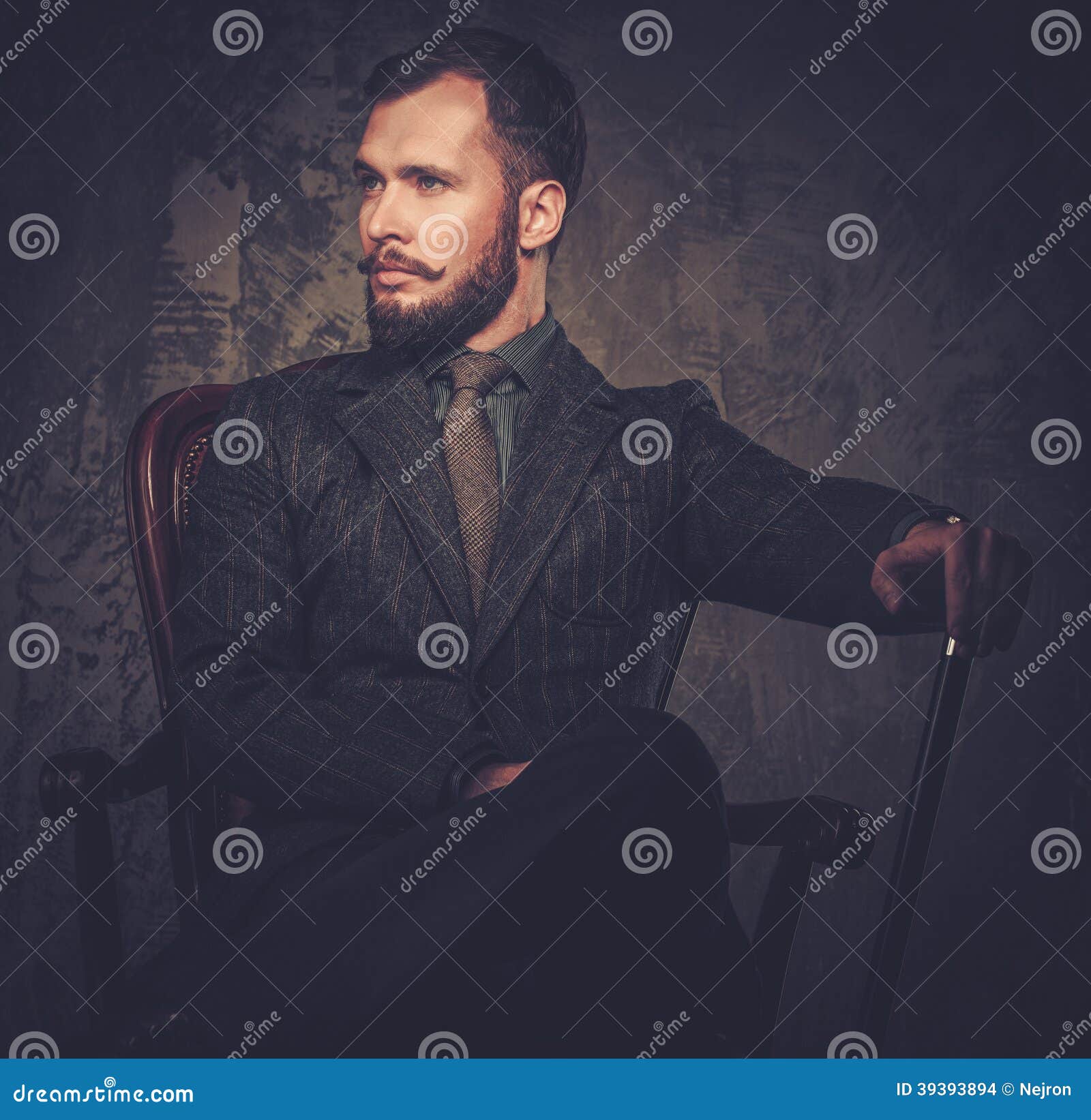 Handsome well-dressed man stock photo. Image of armchair - 39393894