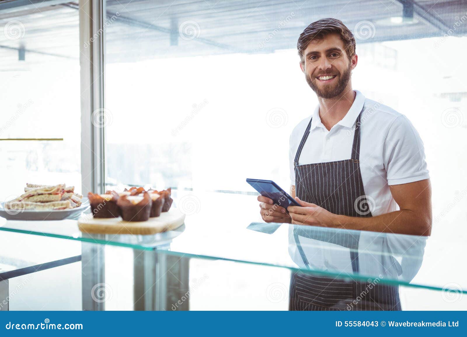 Handsome Worker Posing on the Counter with a Tablet Stock Image - Image ...