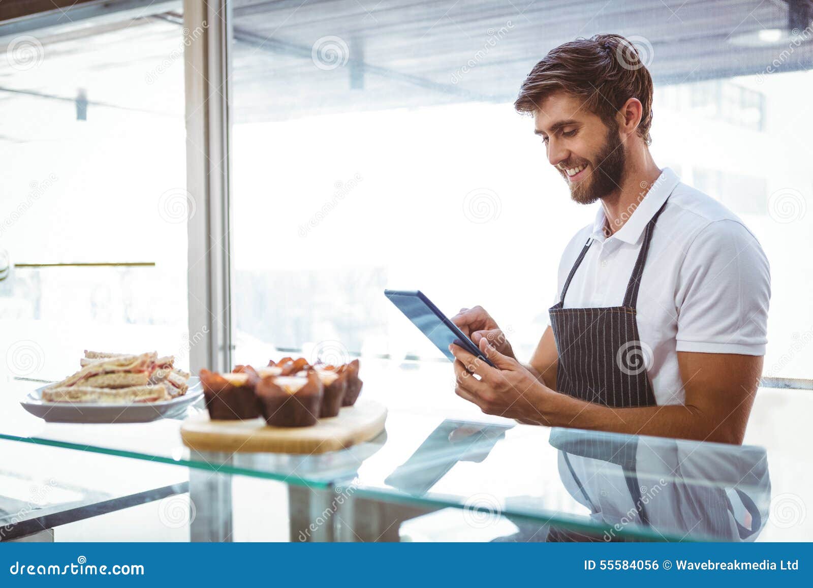 Handsome Worker Posing on the Counter with a Tablet Stock Photo - Image ...