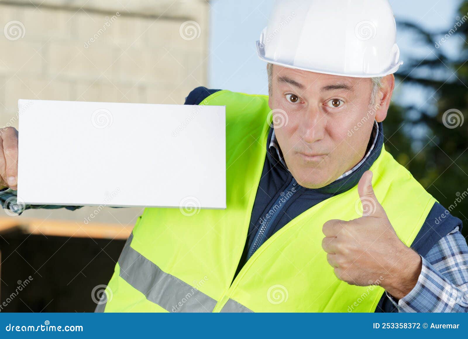 Handsome Worker Shows Thumbs-up while Holding Blank Board Stock Photo ...