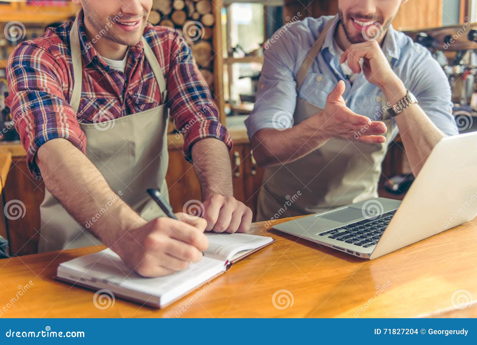 Handsome workers at cafe stock photo. Image of adult - 71827204