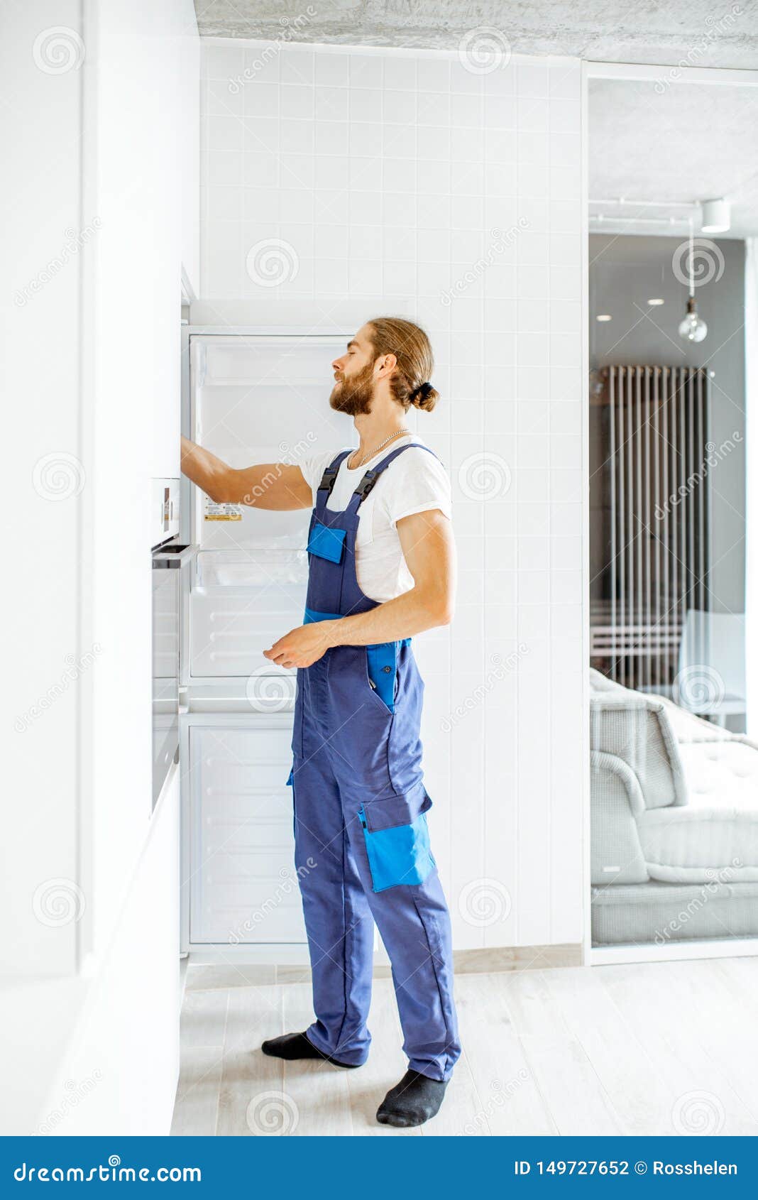 Workman Installing Fridge on the Kitchen at Home Stock Photo - Image of ...