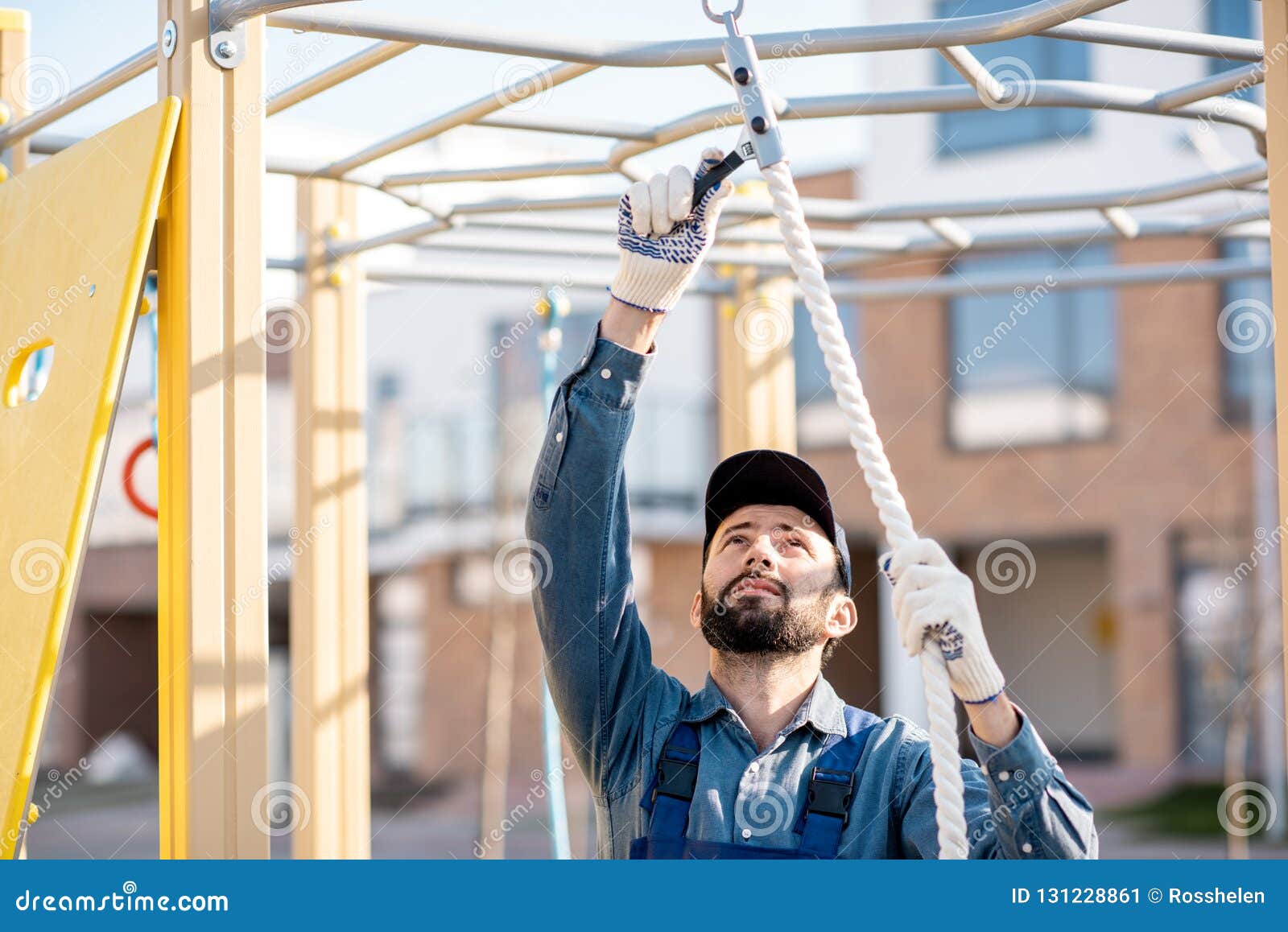 Workman Mounting Playground Stock Image - Image of handyman, recreation ...