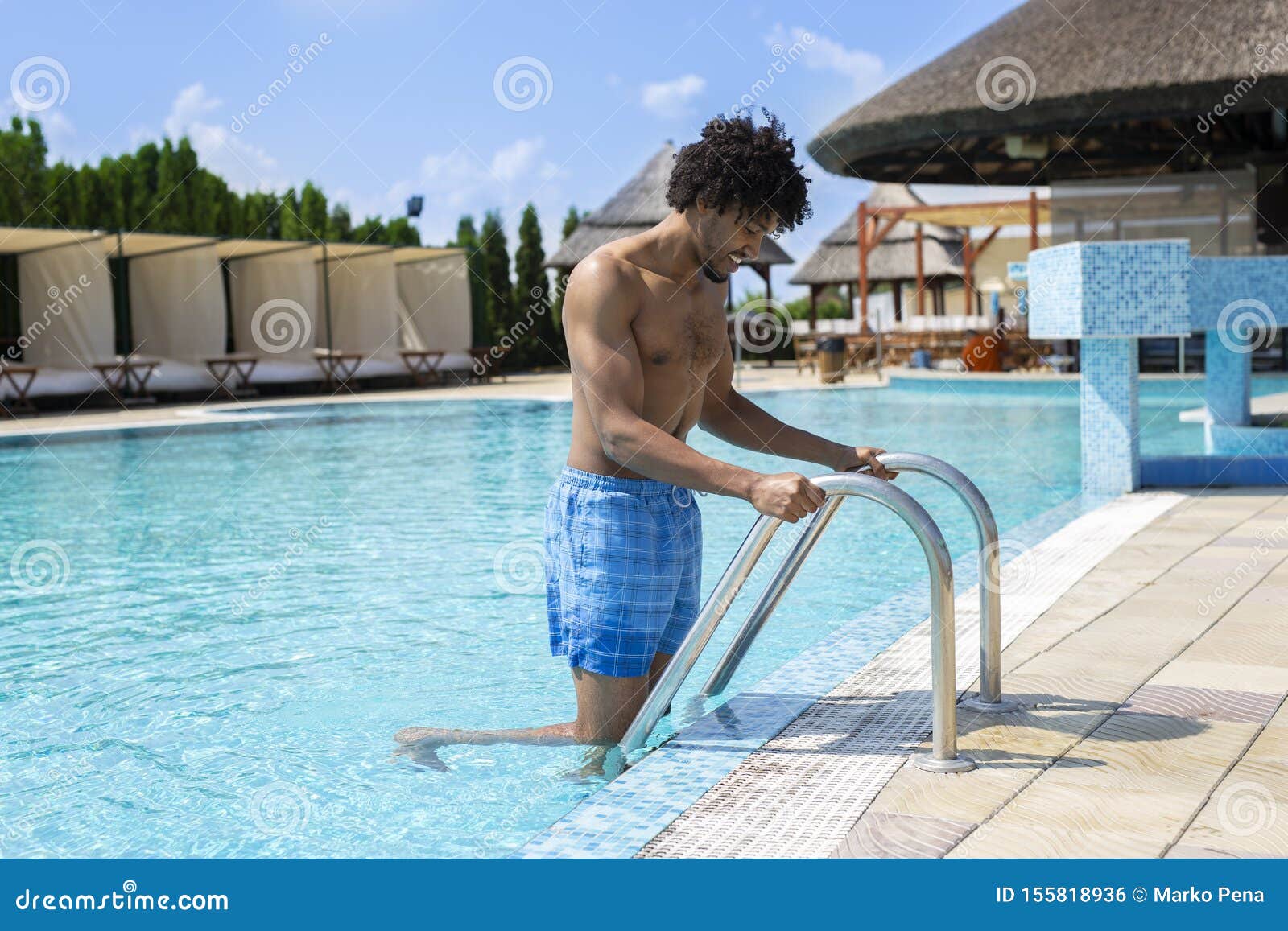 Handsome Young African American Man Getting into a Pool Stock Photo ...