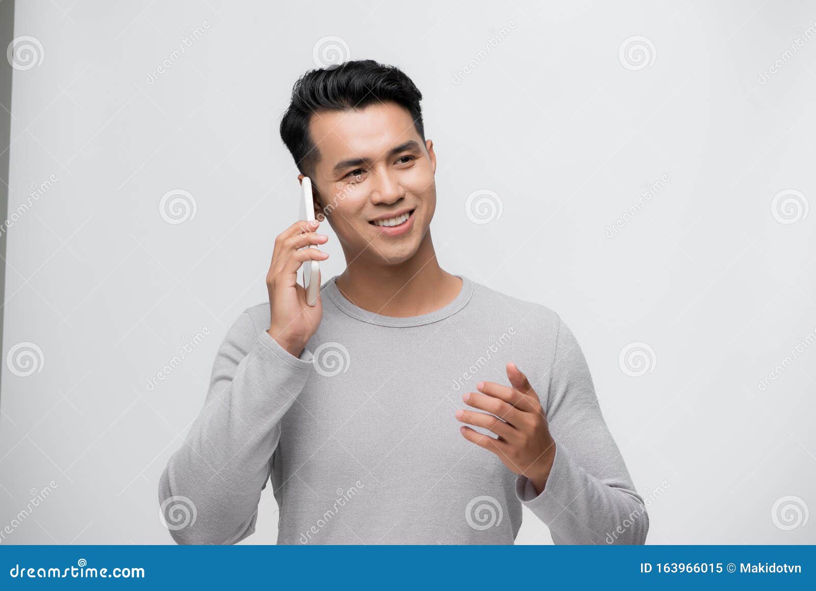 Handsome Young Asian Man Take a Call on White Stock Image - Image of ...