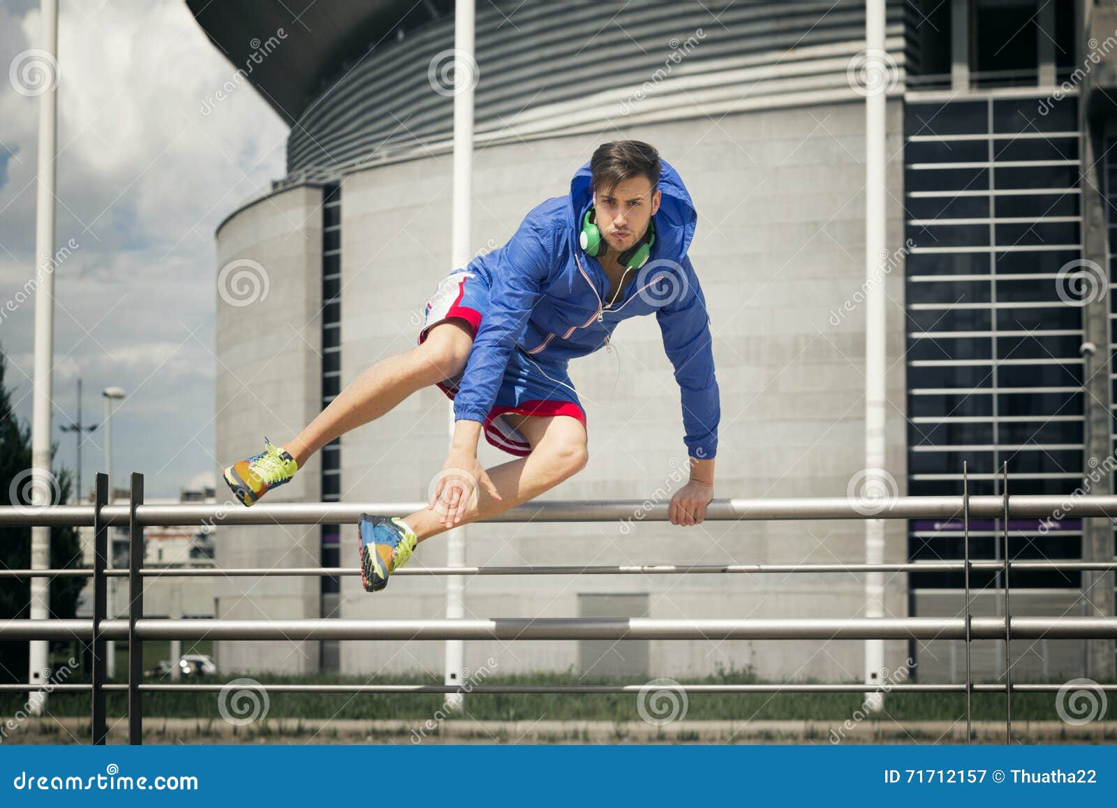 Handsome Young Athlete Jumping Over the Fence Stock Image - Image of ...