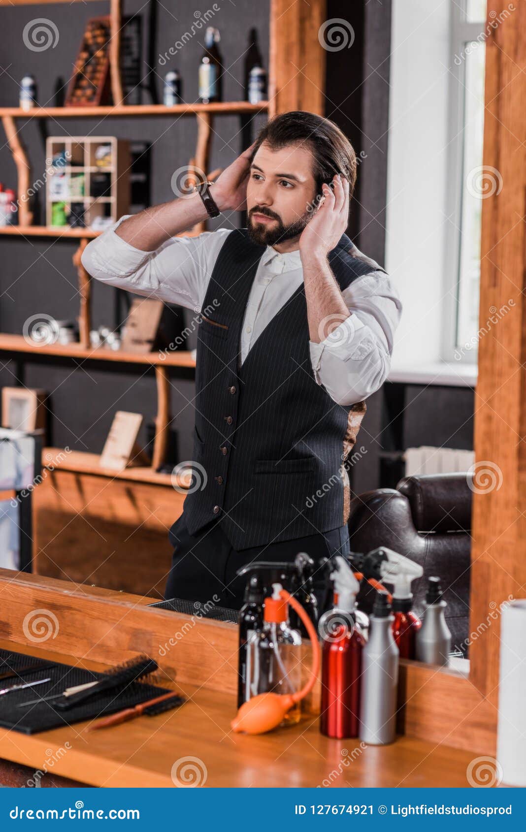 Handsome Young Barber Looking at Mirror Stock Image - Image of alone ...