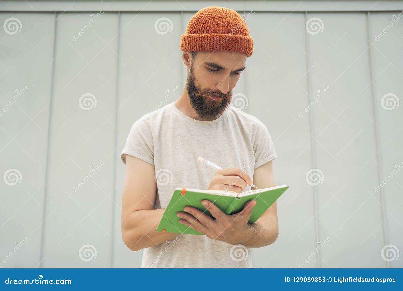 Handsome Young Bearded Man Taking Notes Stock Image - Image of casual ...