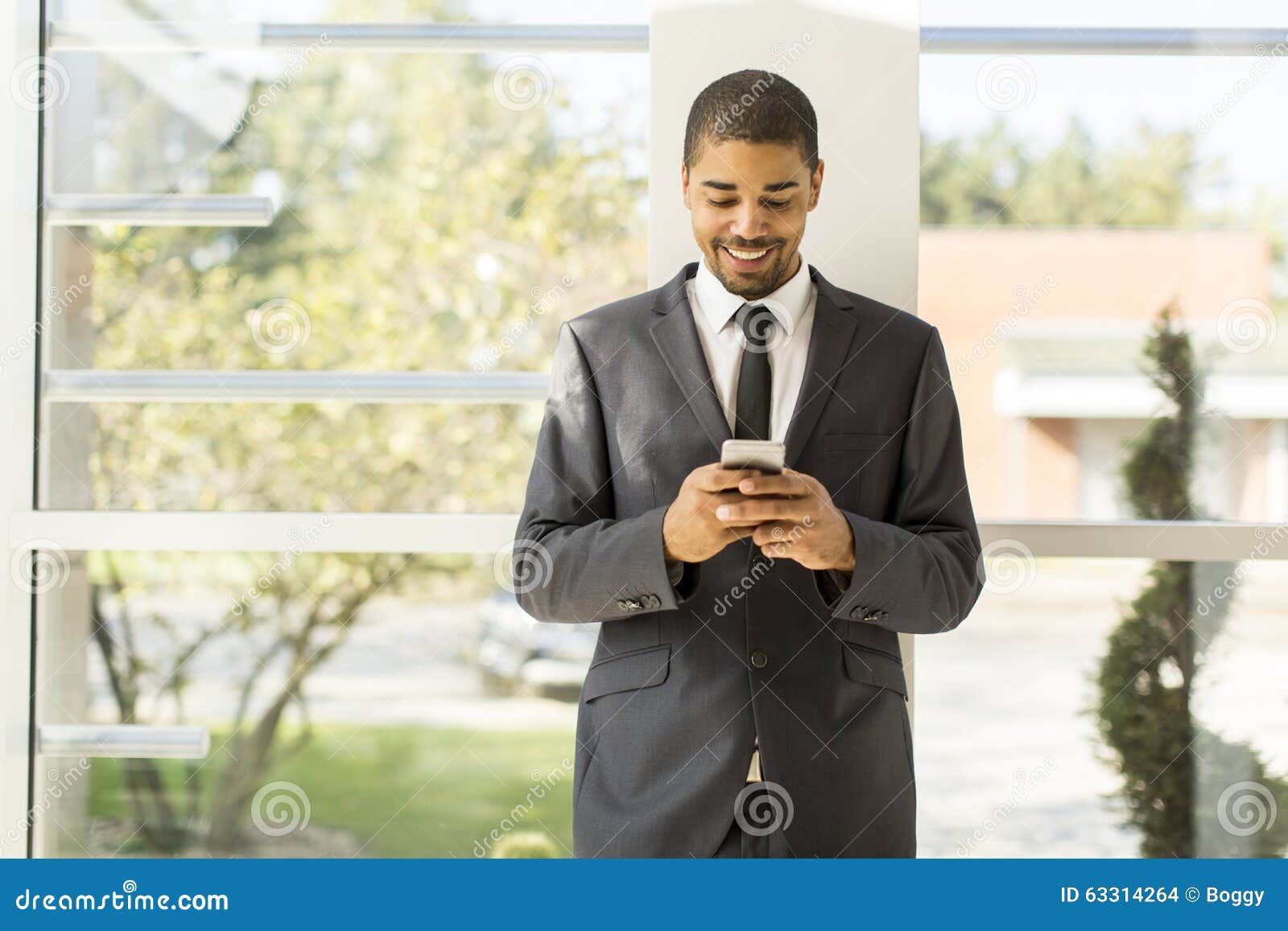 Handsome Young Black Man with Mobile Phone Stock Photo - Image of ...