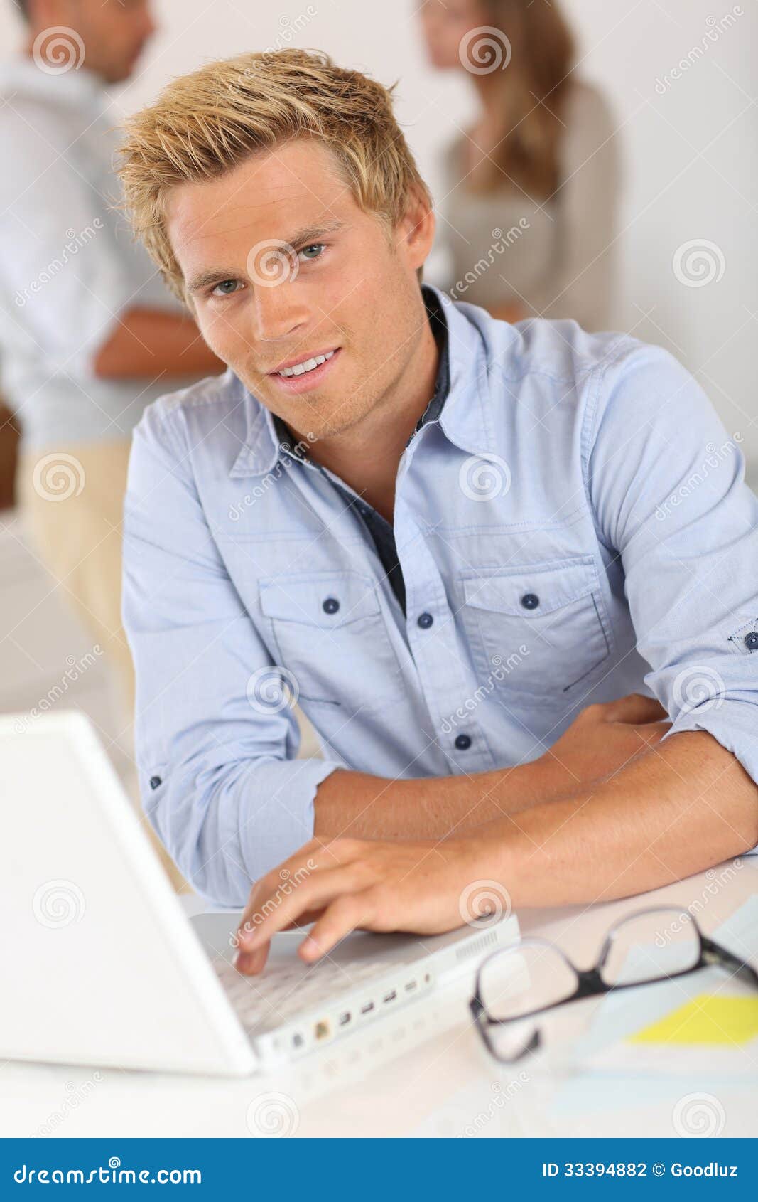 Handsome Young Blond Man Sitting in Office Stock Photo - Image of teeth ... Handsome Young Blond Man Sitting in Office Stock Photo - Image of teeth ...
