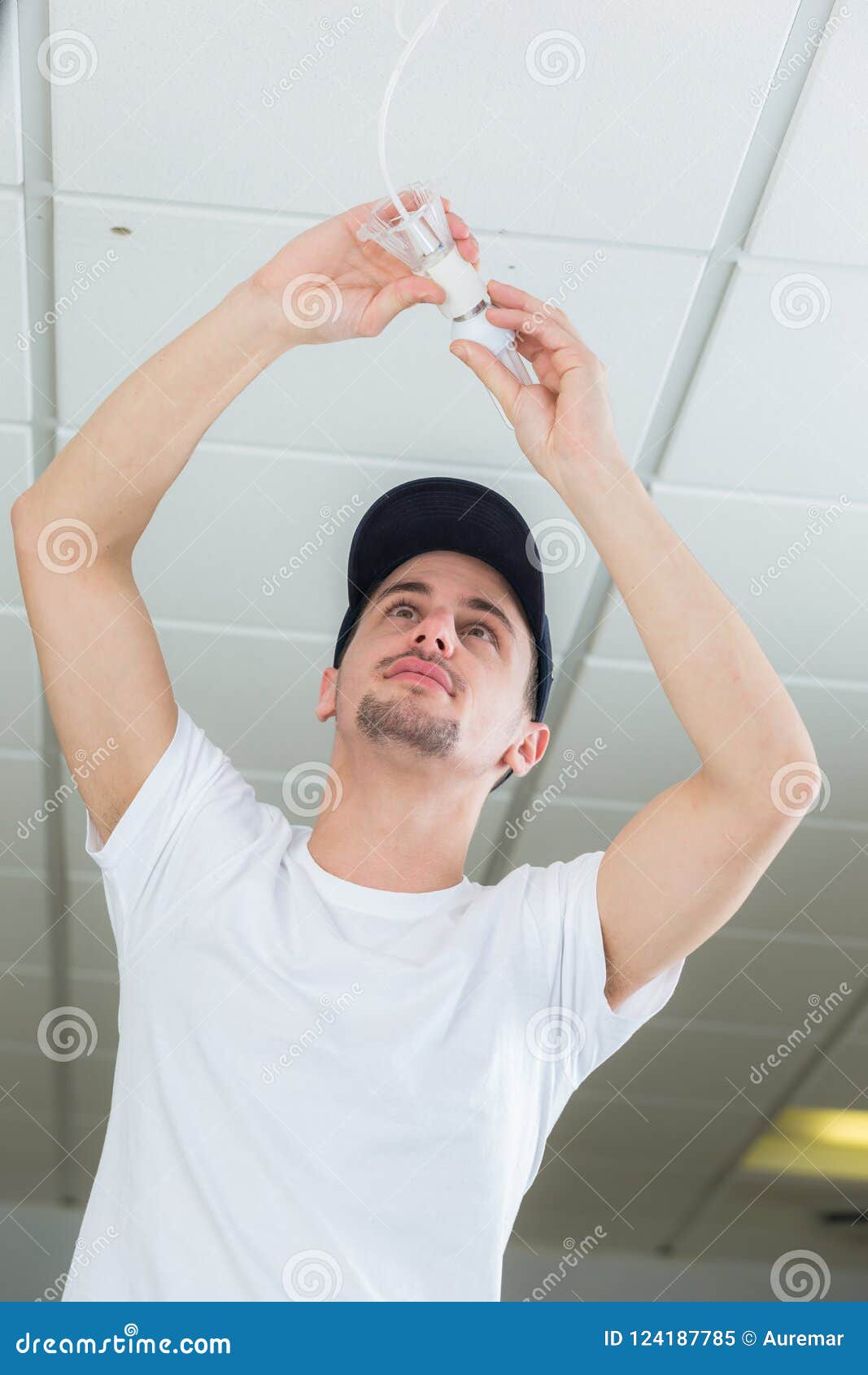 Handsome Young Builder Installing Light Bulb Indoors Stock Image ...
