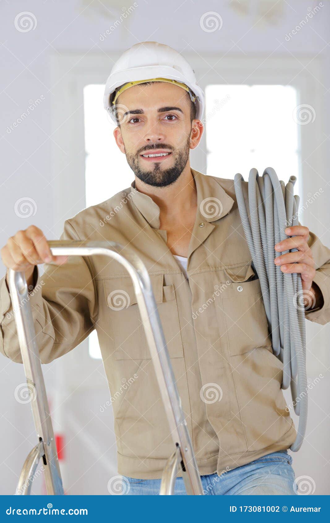 Handsome Young Builder Using Ladder Indoors Stock Photo - Image of ...