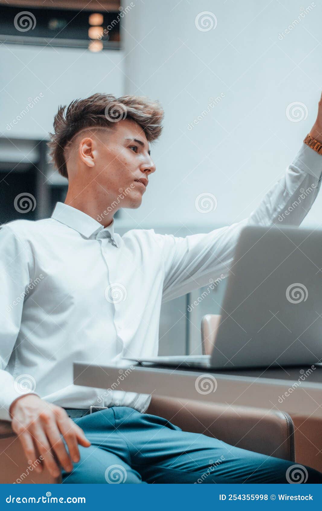 Young Business Boy Working on a Laptop in the Office Stock Photo ...