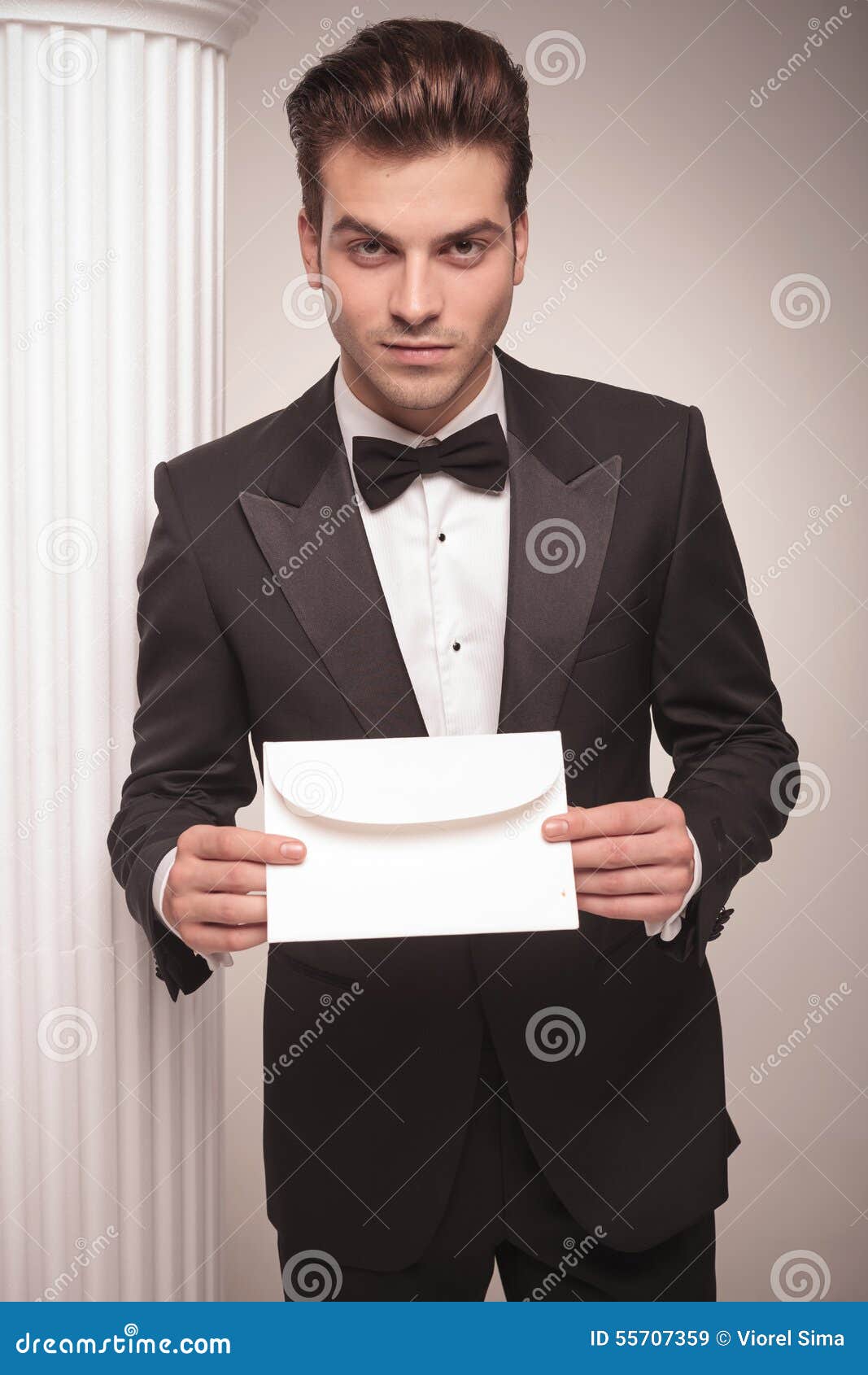 Handsome Young Business Man Giving You a White Envelope. Stock Image ...