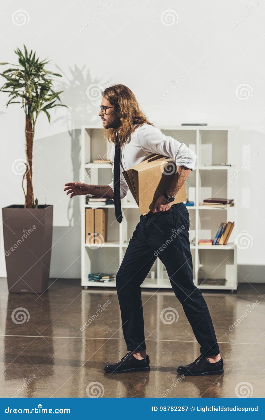 Handsome Young Businessman Holding Folders and Running in Office Stock ...