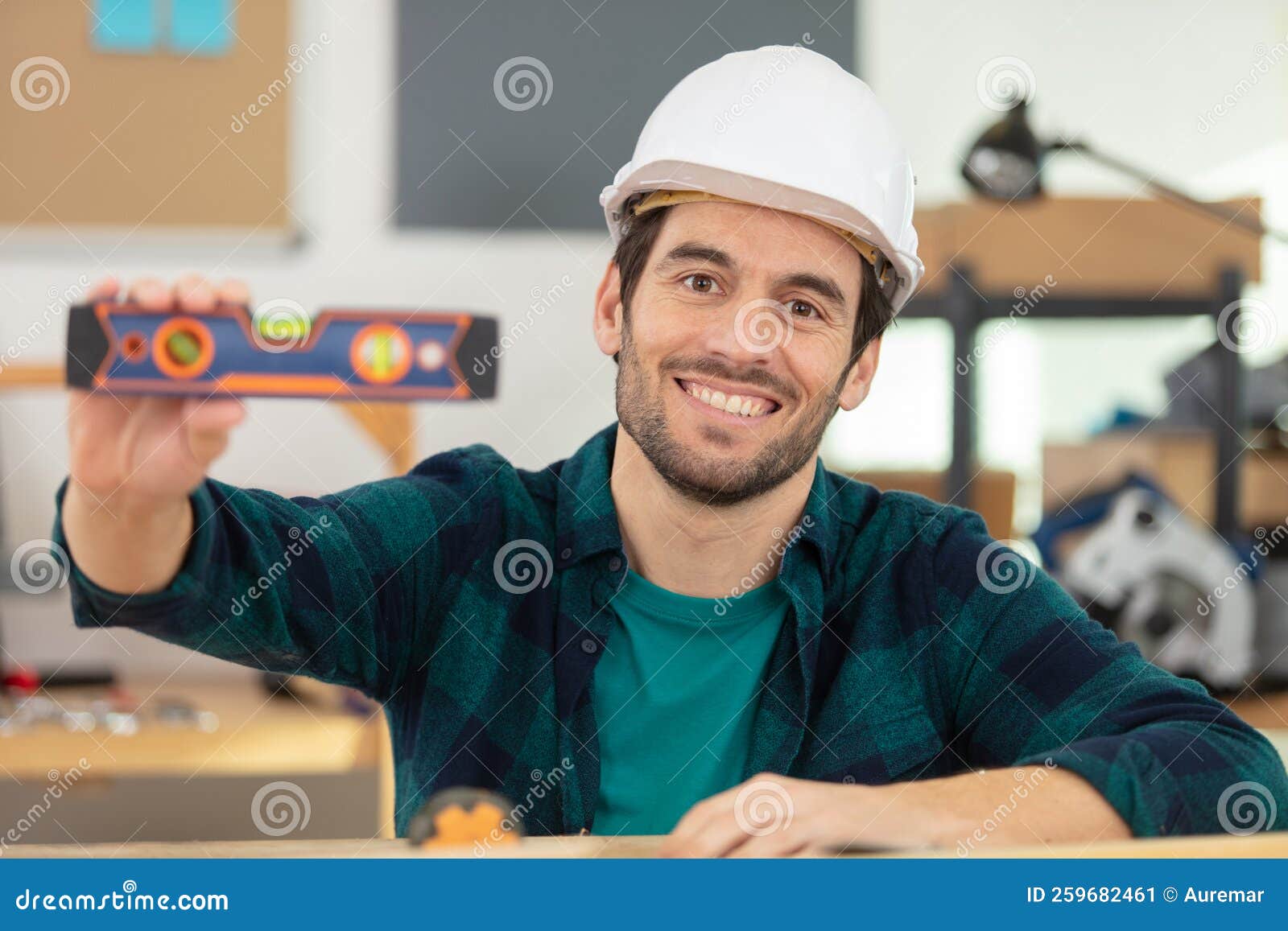 Handsome Young Carpenter Measuring with Spirit Level Stock Image ...