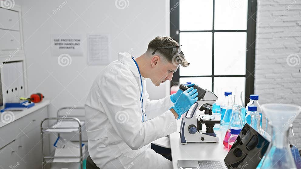 Handsome Young Caucasian Man, a Dedicated Scientist, Deeply Engrossed ...