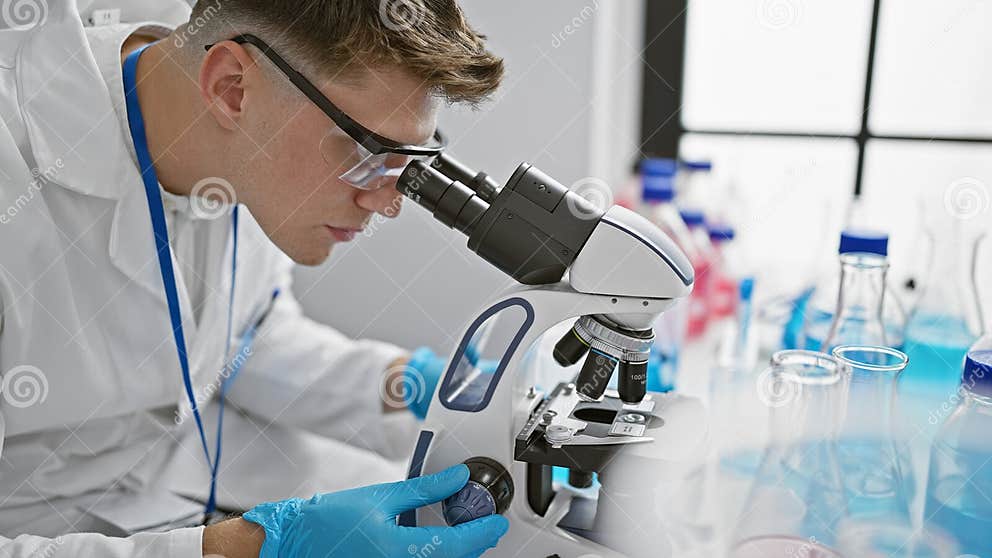 Handsome Young Caucasian Man, a Dedicated Scientist, Deeply Engrossed ...