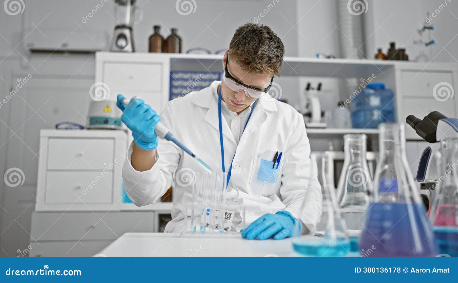Handsome Young Caucasian Scientist Man, Meticulously Pouring Liquid ...