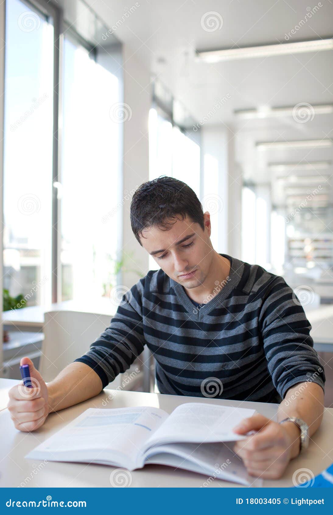 Handsome Young College Student in a Library Stock Image - Image of ...